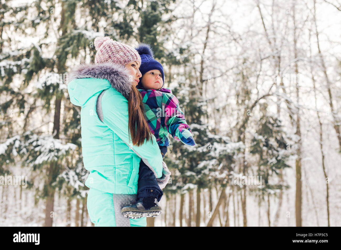 Happy family. Mother and child girl on a winter walk in nature Stock Photo - Alamy