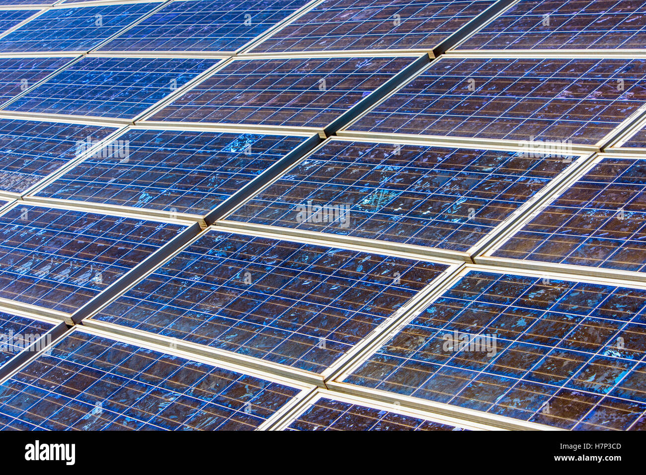 Close up of blue solar panels with blue sky, renewables Stock Photo - Alamy