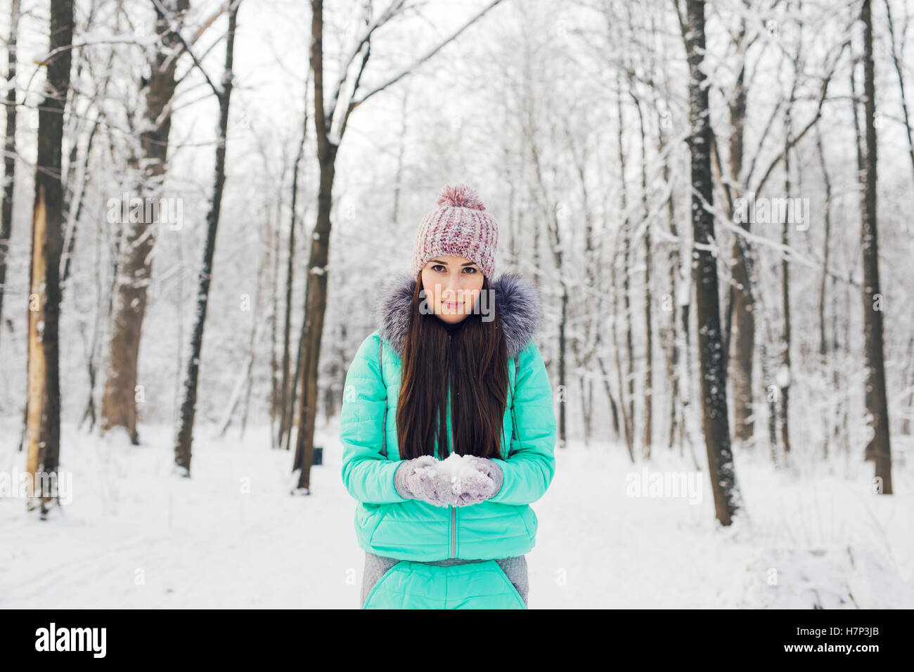 Girl in winter snowy park. Snow, cold and seasonal concept Stock Photo ...