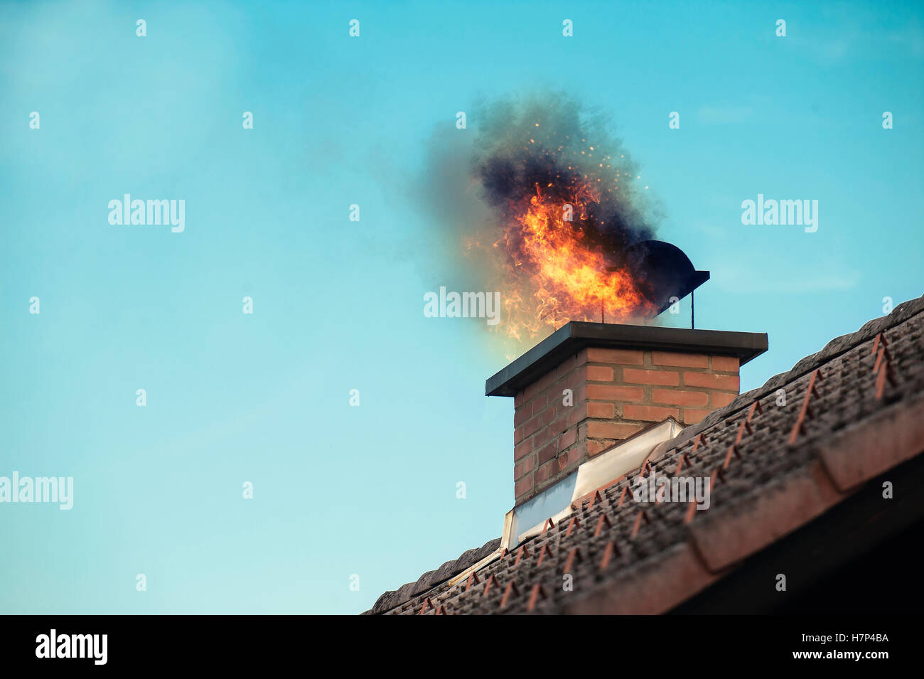 Chimney with fire coming out Stock Photo - Alamy