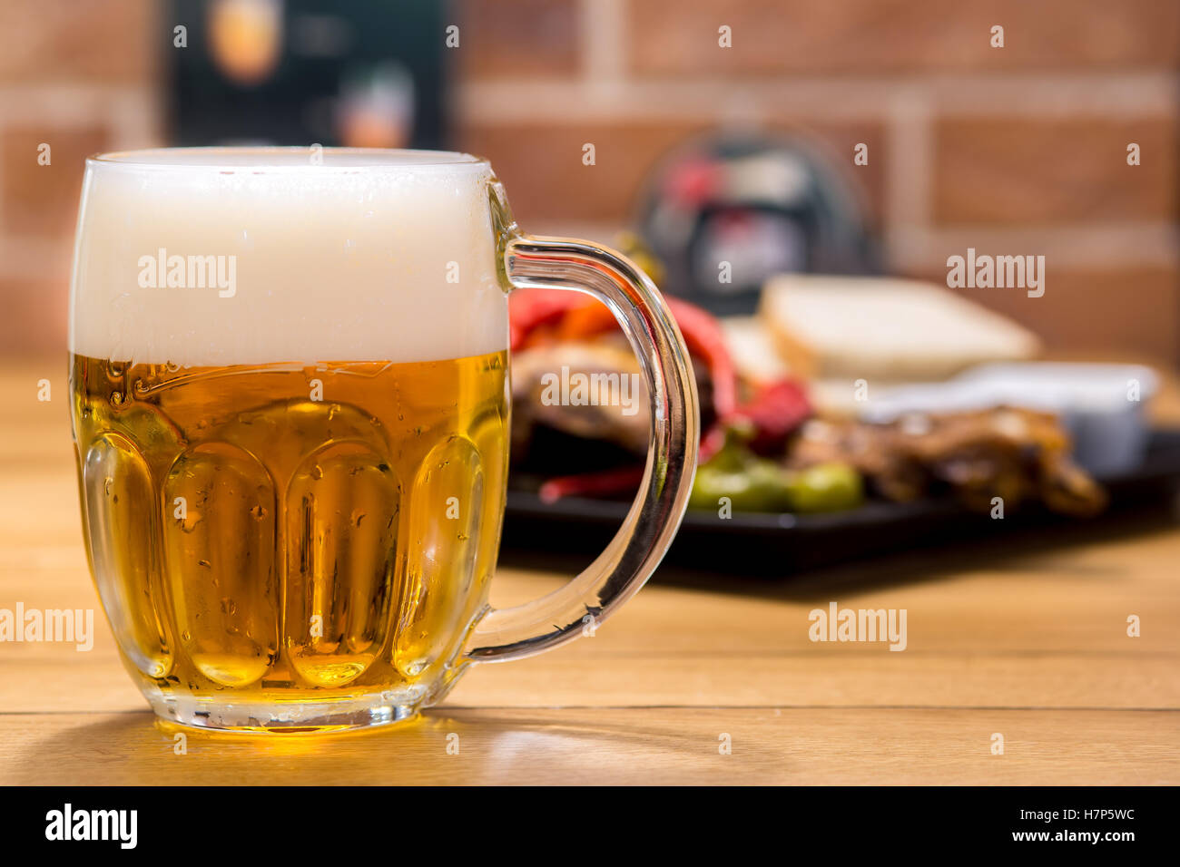 Pint of beer with food Stock Photo - Alamy