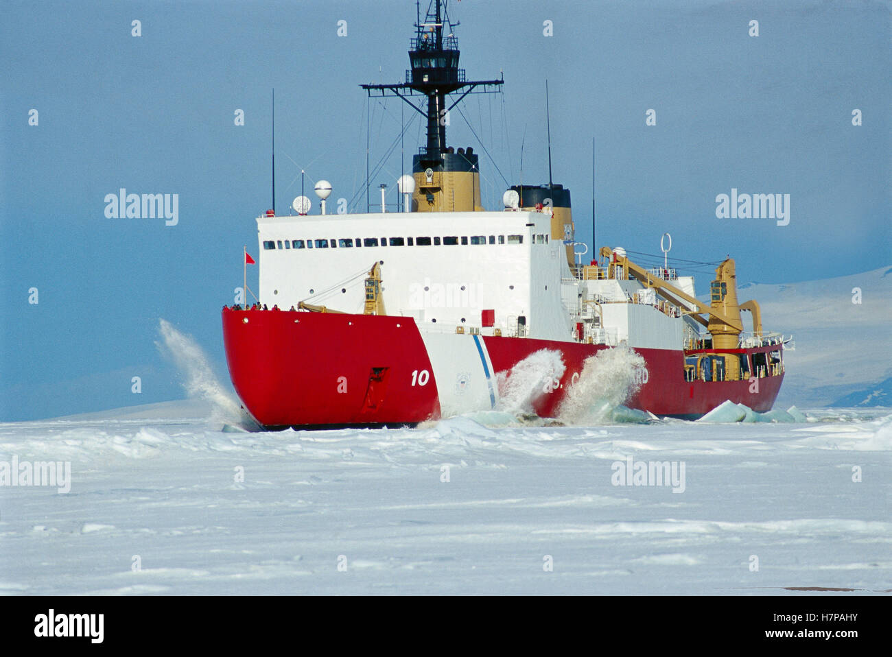 Coast Guard icebreaker cutting through sea ice, creates an ice channel ...