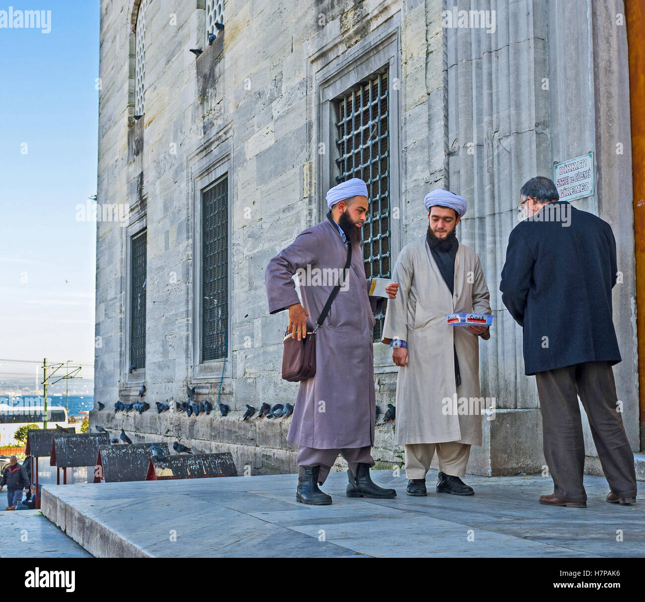 The mullas collect the sadaqat (donations) at the entrance to the New Mosque in the city center ...