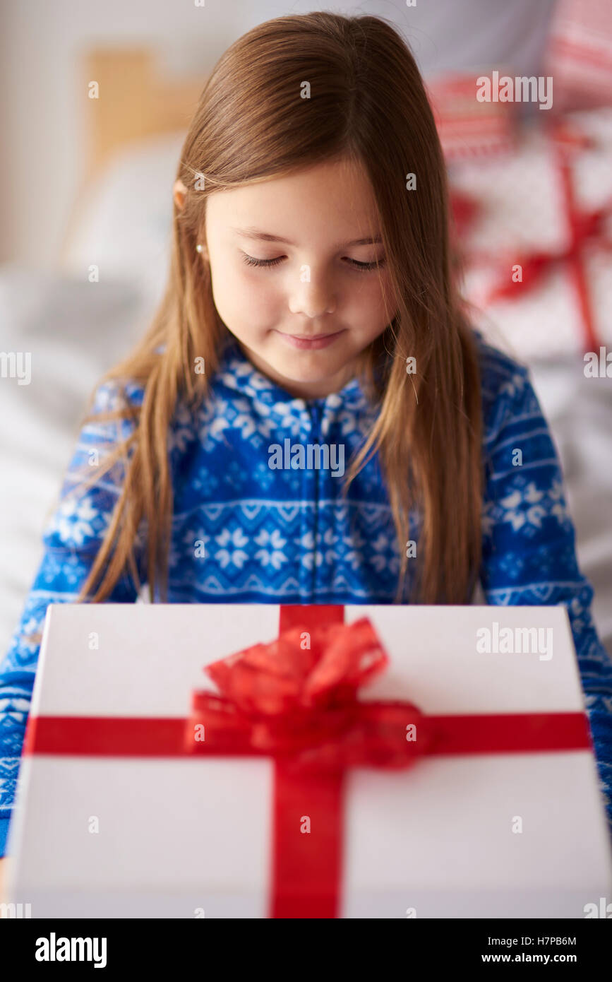 Small girl with big Christmas present Stock Photo - Alamy