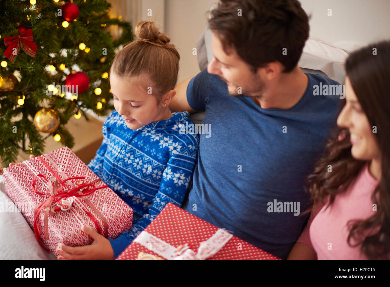 Family in Christmas morning with presents Stock Photo - Alamy