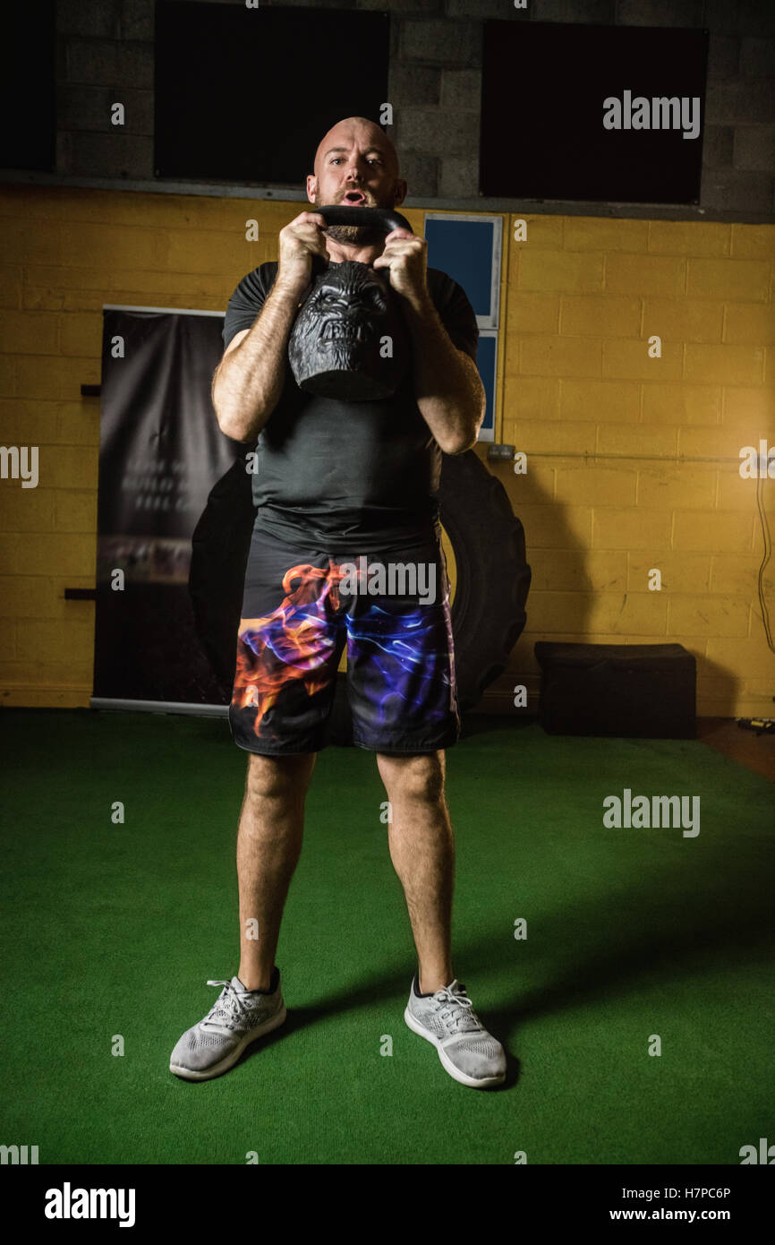 Thai boxer lifting weight Stock Photo - Alamy