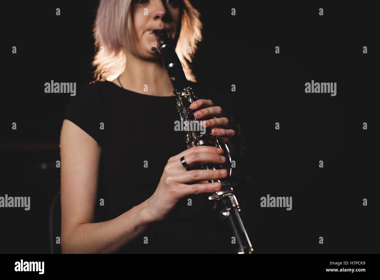 Woman playing a clarinet in music school Stock Photo - Alamy