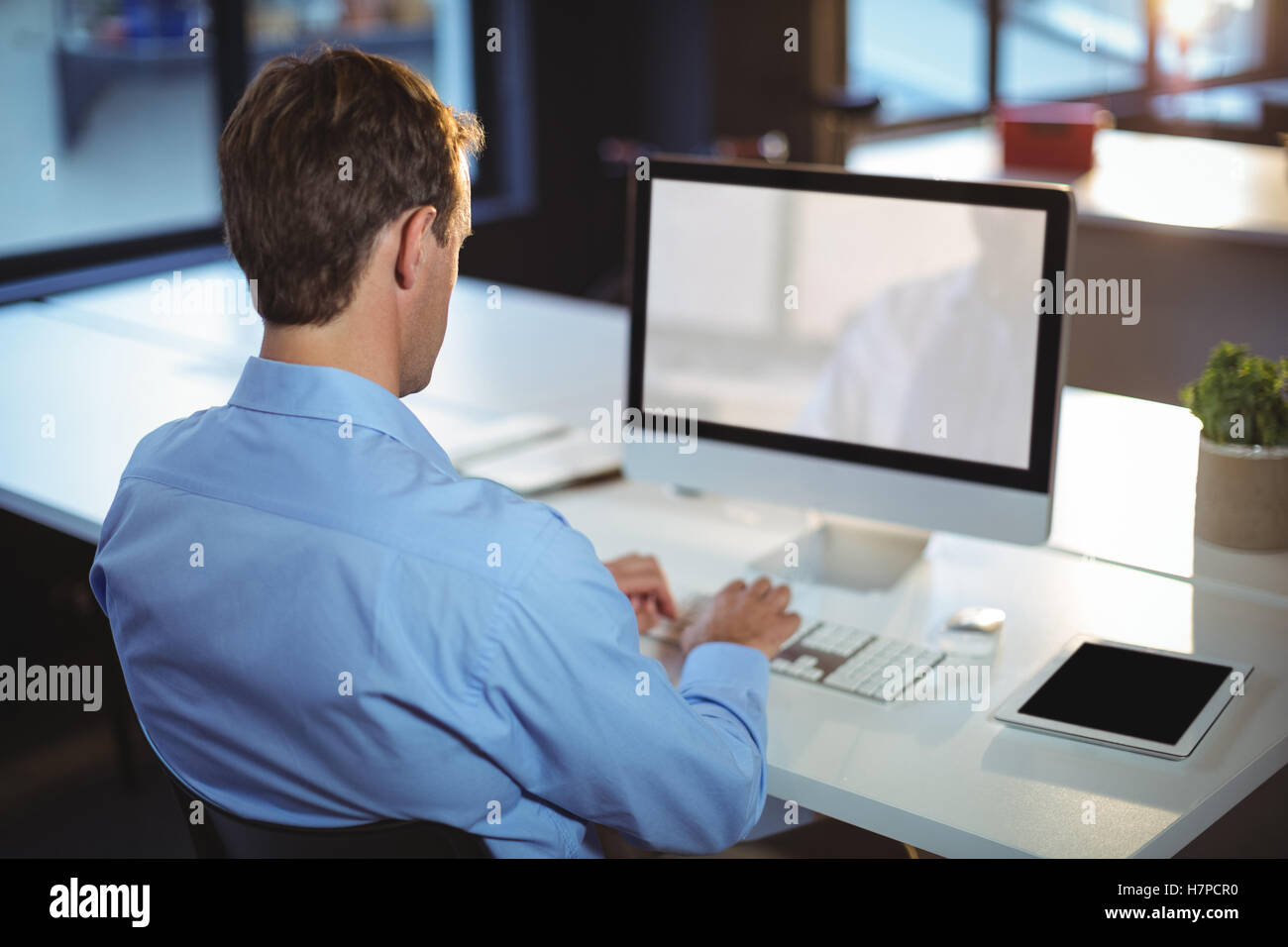 Rear view caucasian businessman using hi-res stock photography and ...