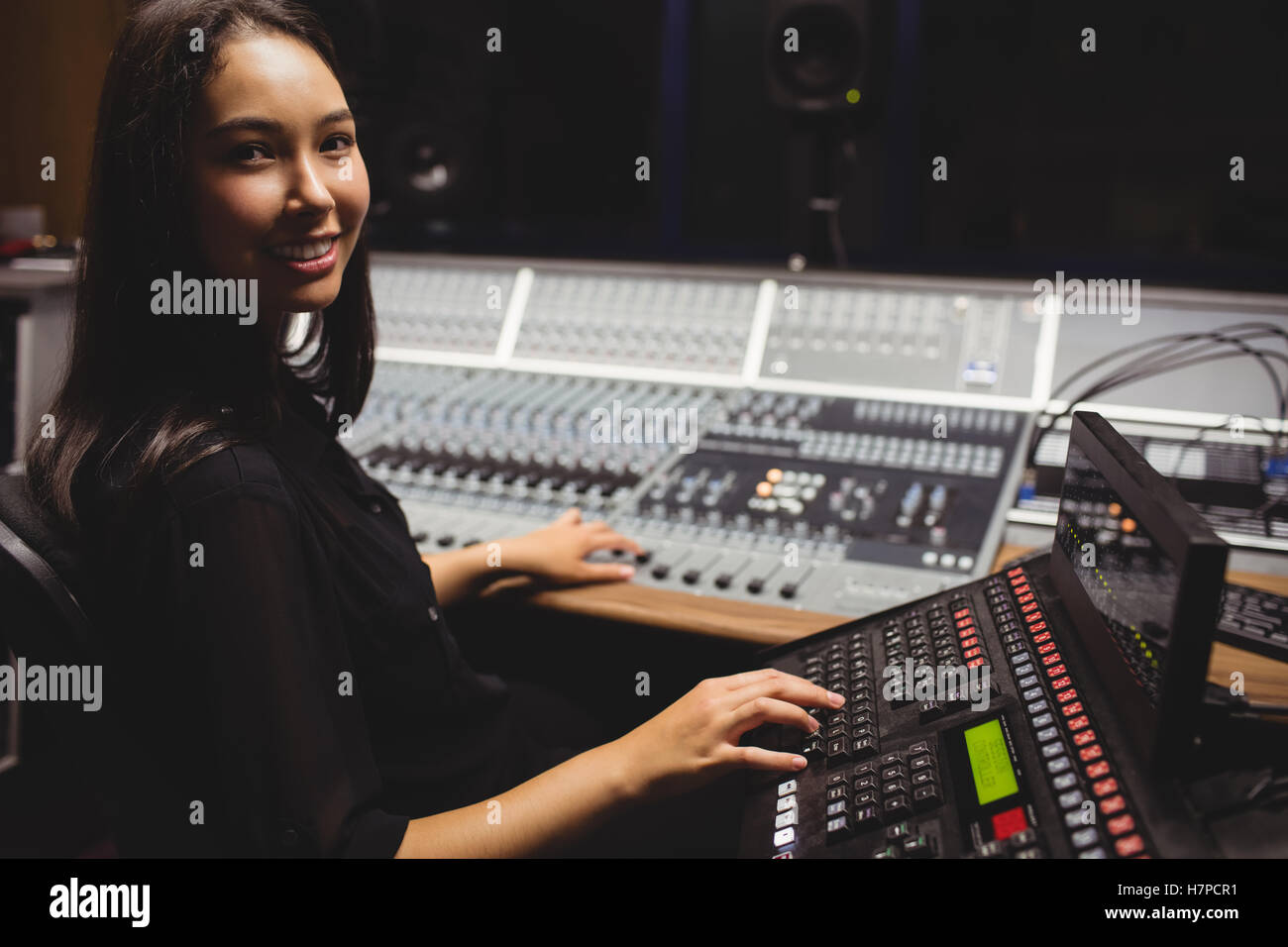 Female student using sound mixer keyboard Stock Photo - Alamy