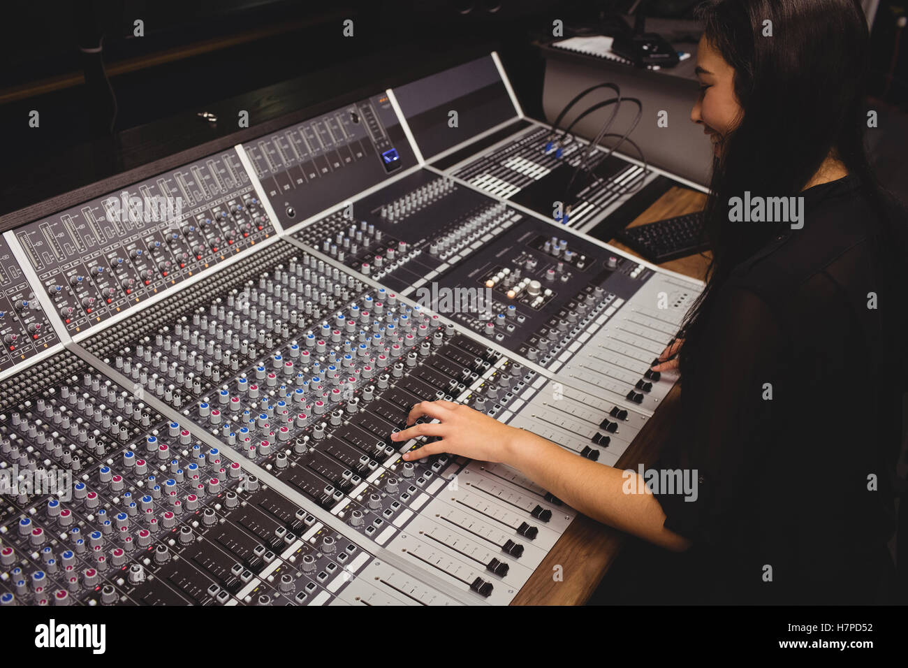 Female student using sound mixer Stock Photo - Alamy
