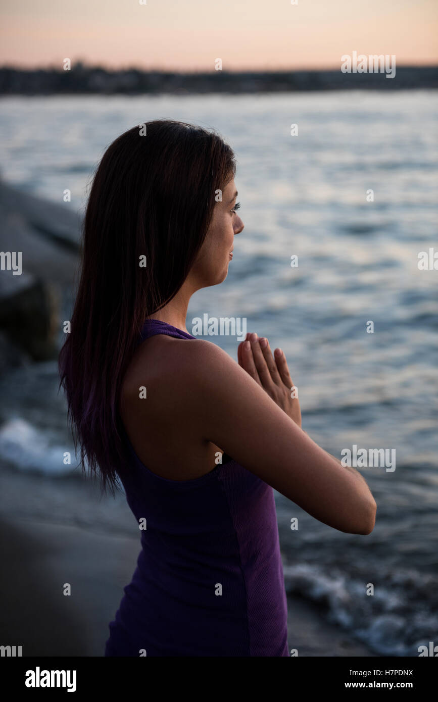 Woman praying beach hi-res stock photography and images - Alamy