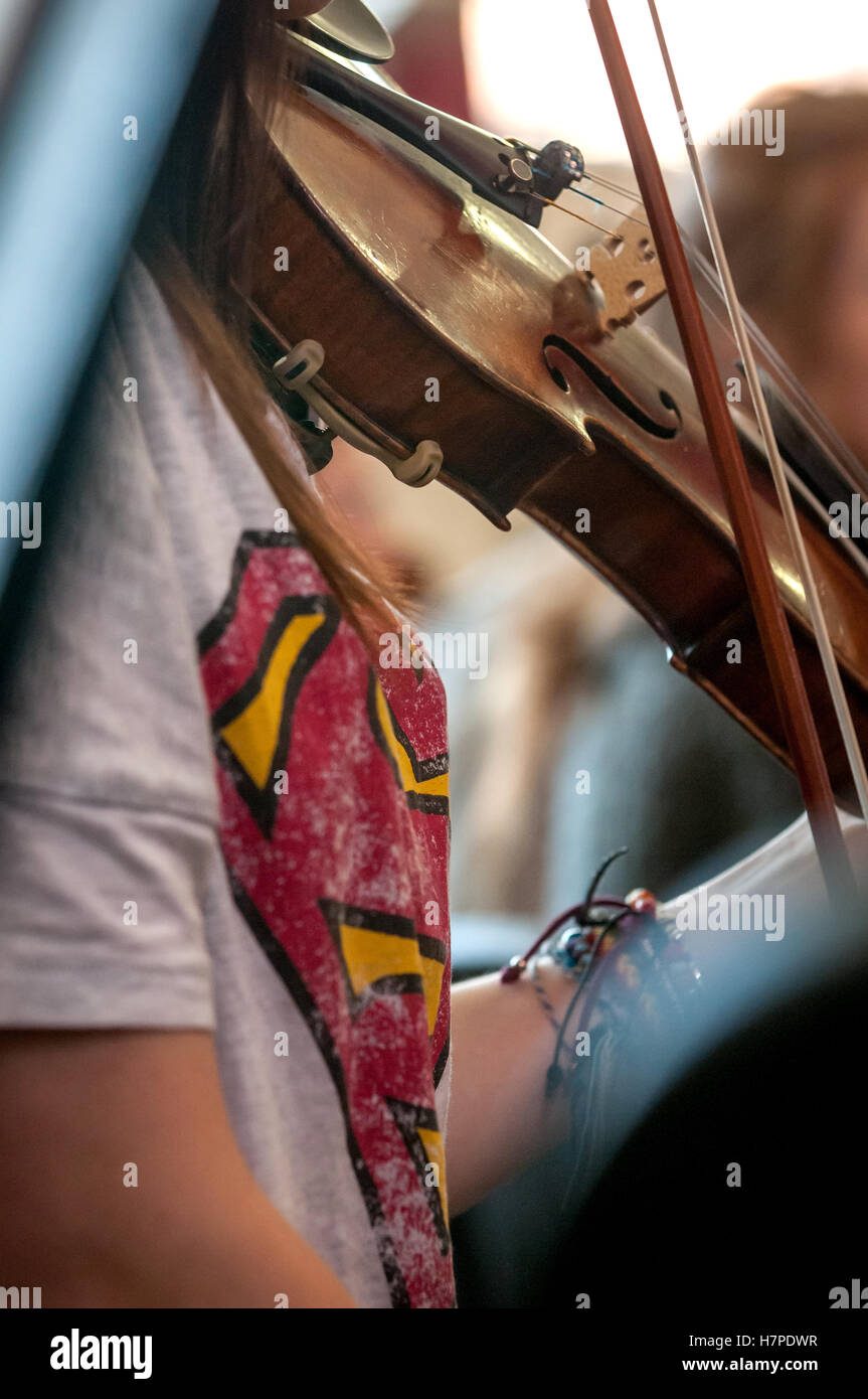Close up of musical instrument being played by young person Stock Photo ...