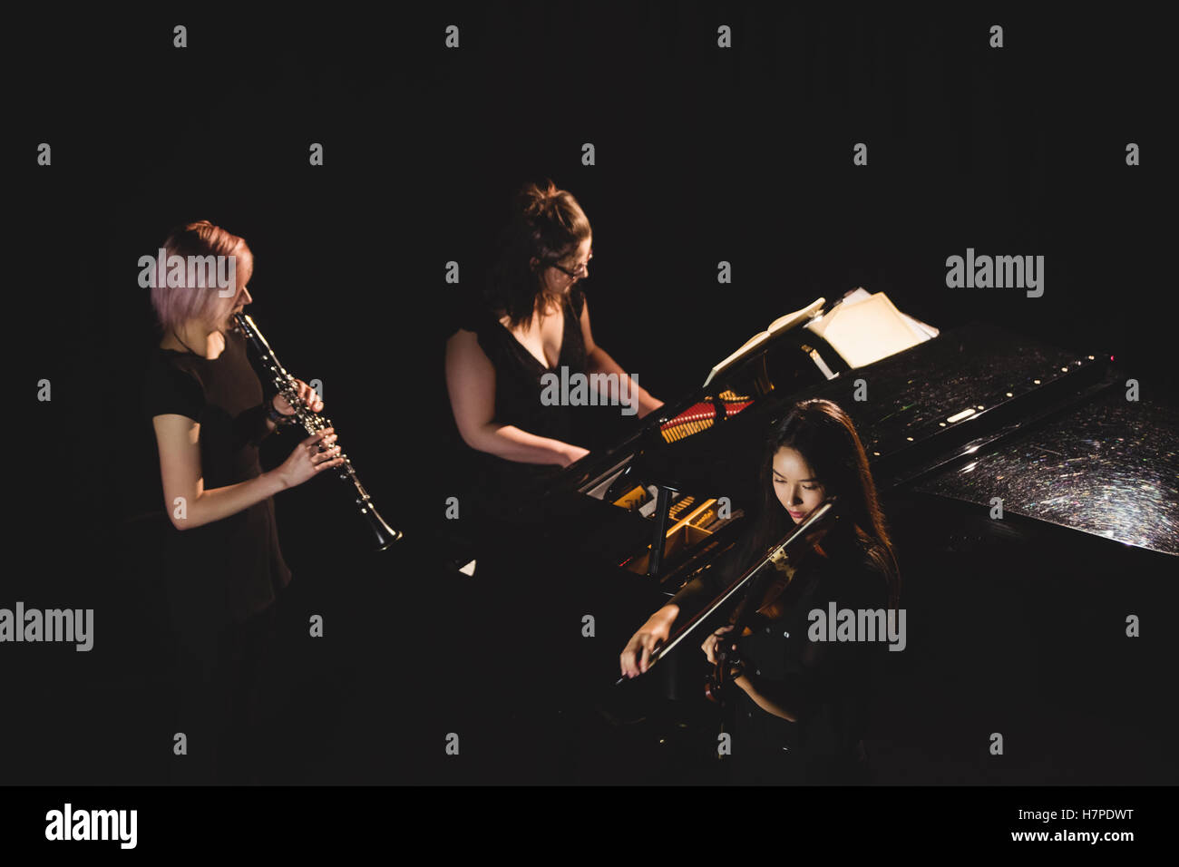 Women playing various instrument Stock Photo - Alamy