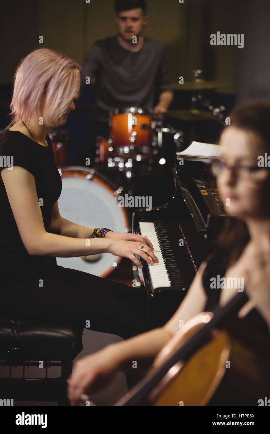Students playing musical instruments hi-res stock photography and ...