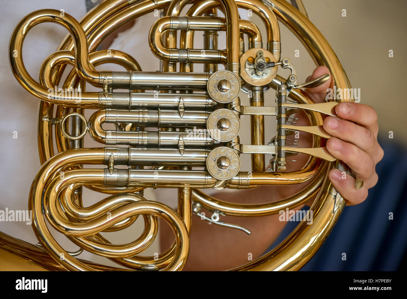Close up of musical instrument being played by young person Stock Photo ...