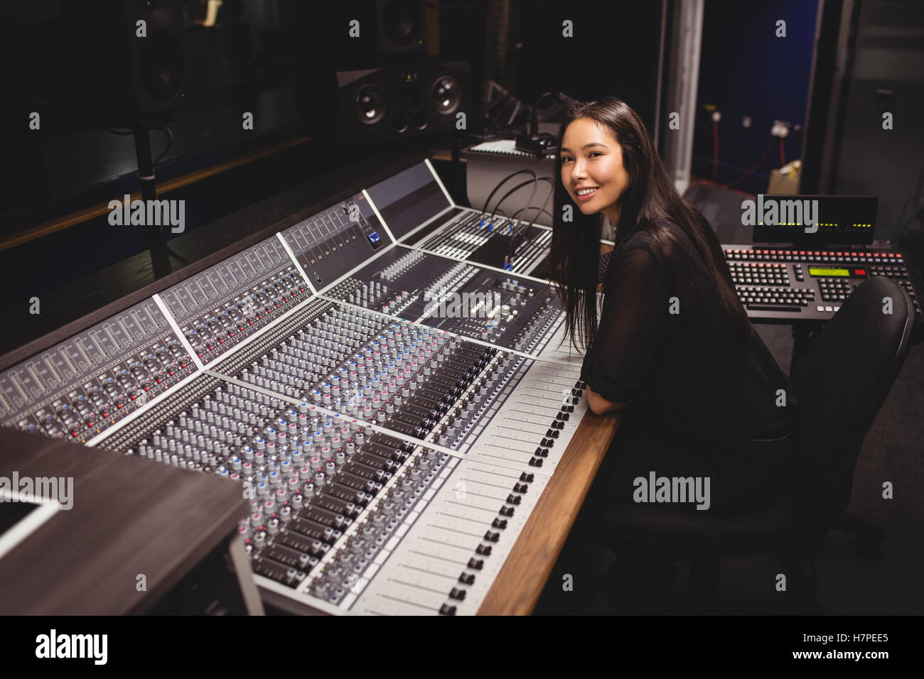 Female student using sound mixer Stock Photo - Alamy