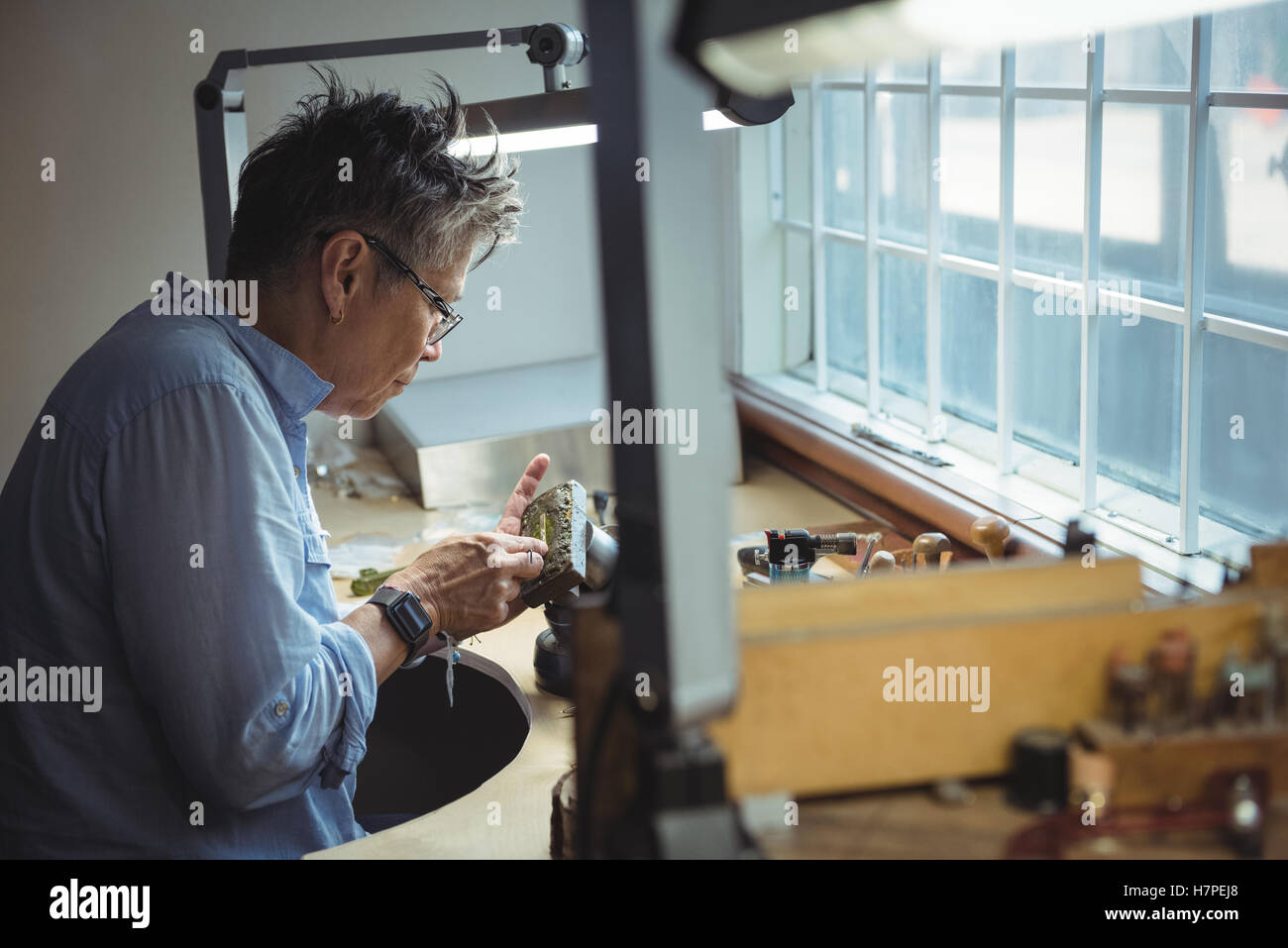 Craftswoman working in workshop Stock Photo - Alamy