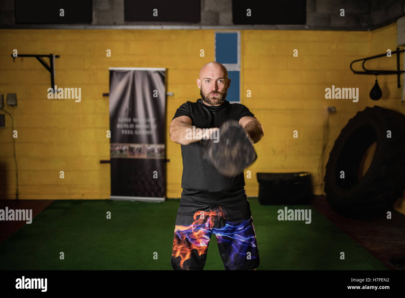 Thai boxer lifting weight Stock Photo - Alamy
