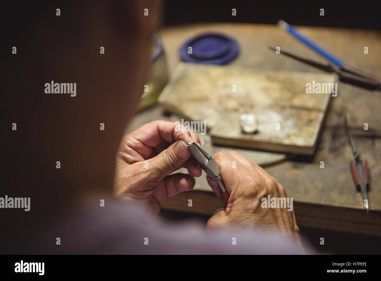 Craftswoman using pliers Stock Photo - Alamy