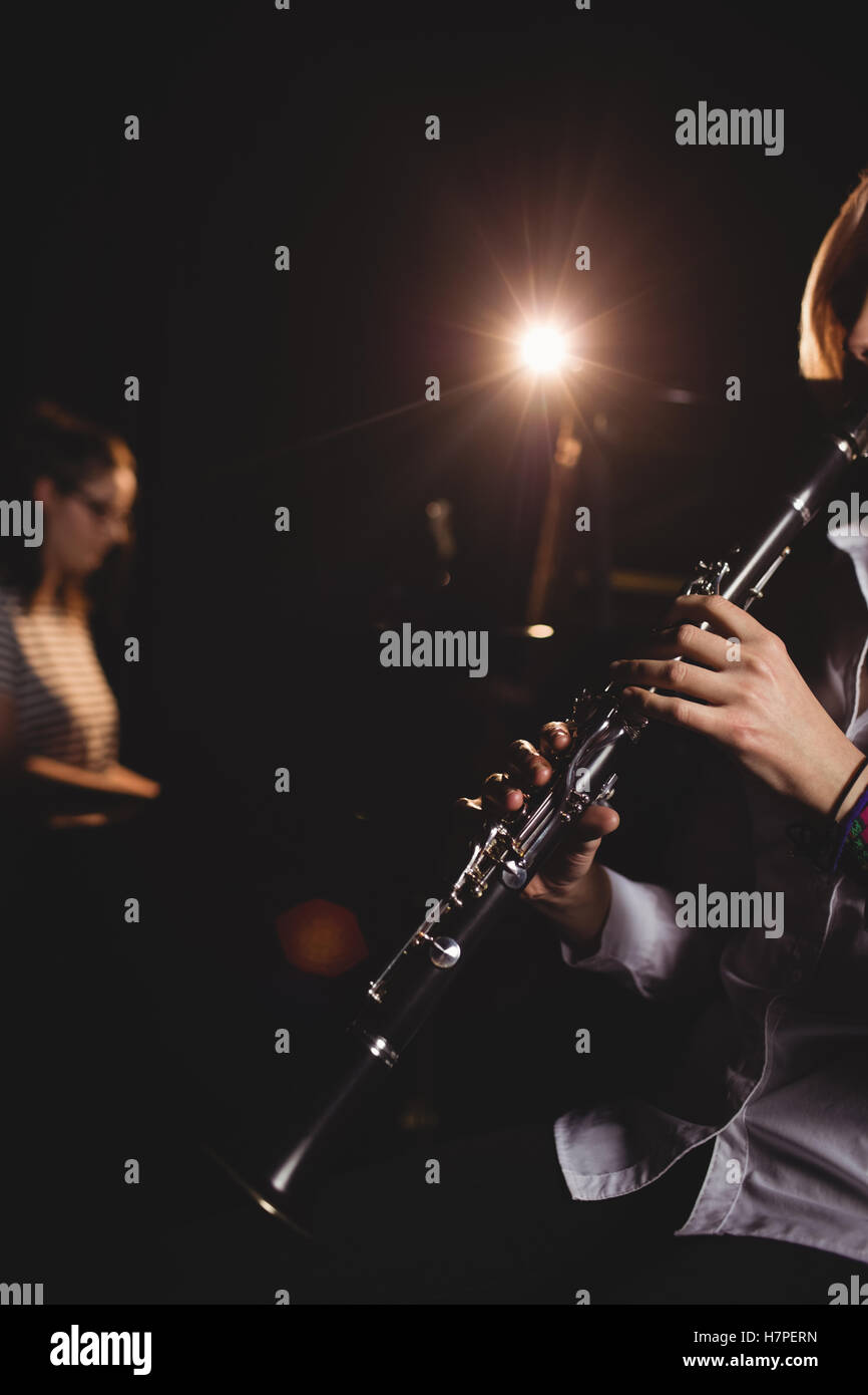 Two female students playing clarinet and piano Stock Photo - Alamy