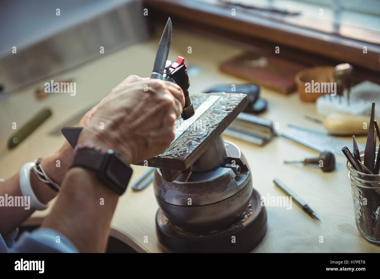 Hands of craftswoman using tools Stock Photo - Alamy