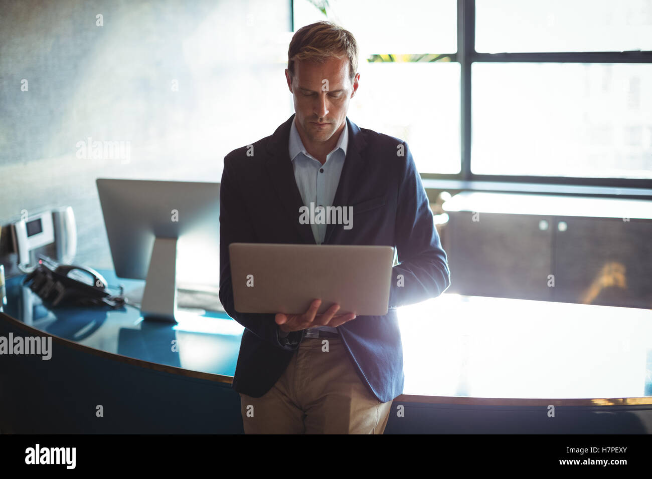Businessman using laptop telephone hi-res stock photography and images ...
