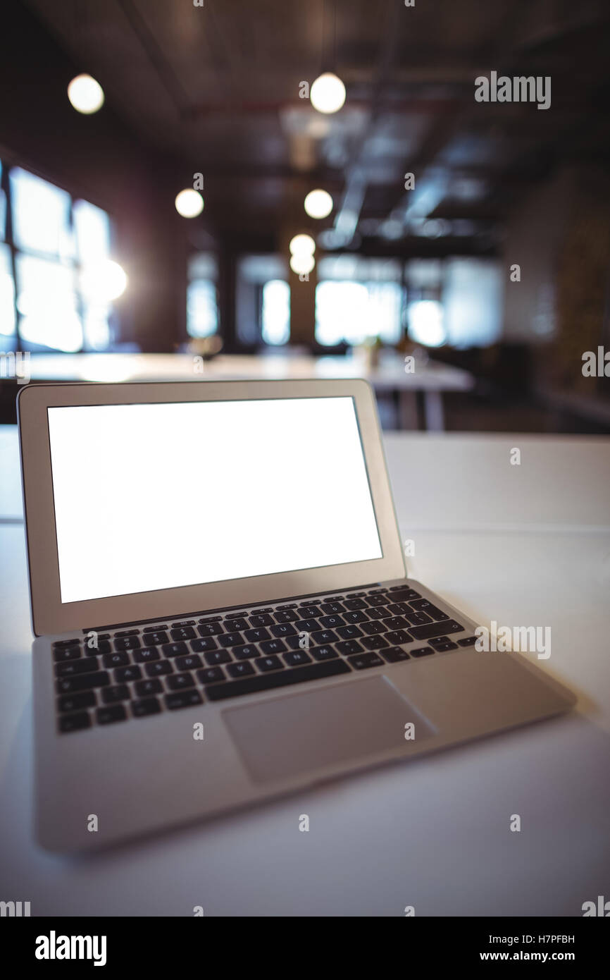 Laptop on desk Stock Photo - Alamy