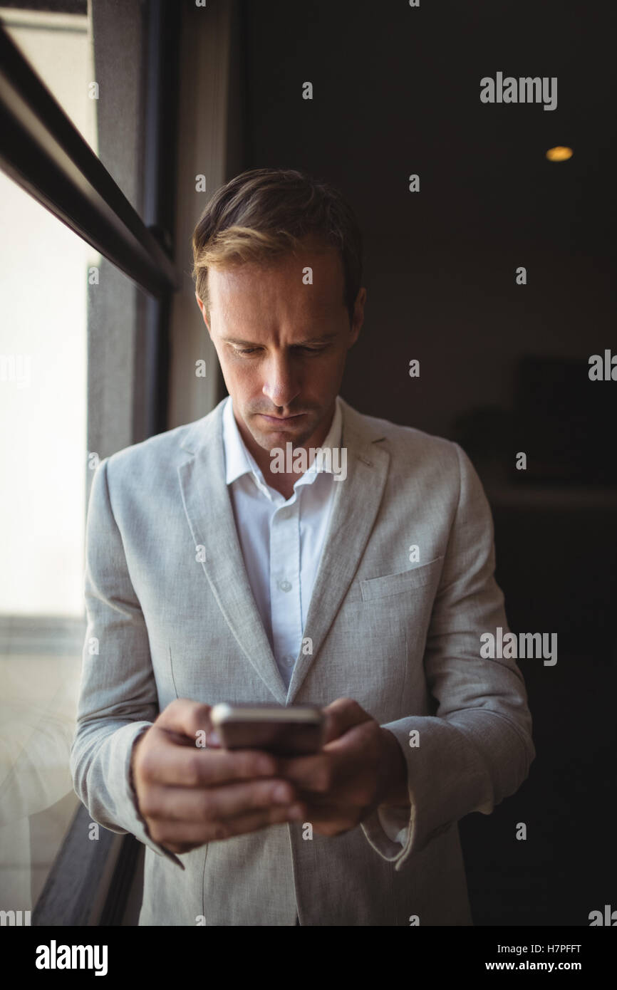Businessman using his mobile phone hi-res stock photography and images ...