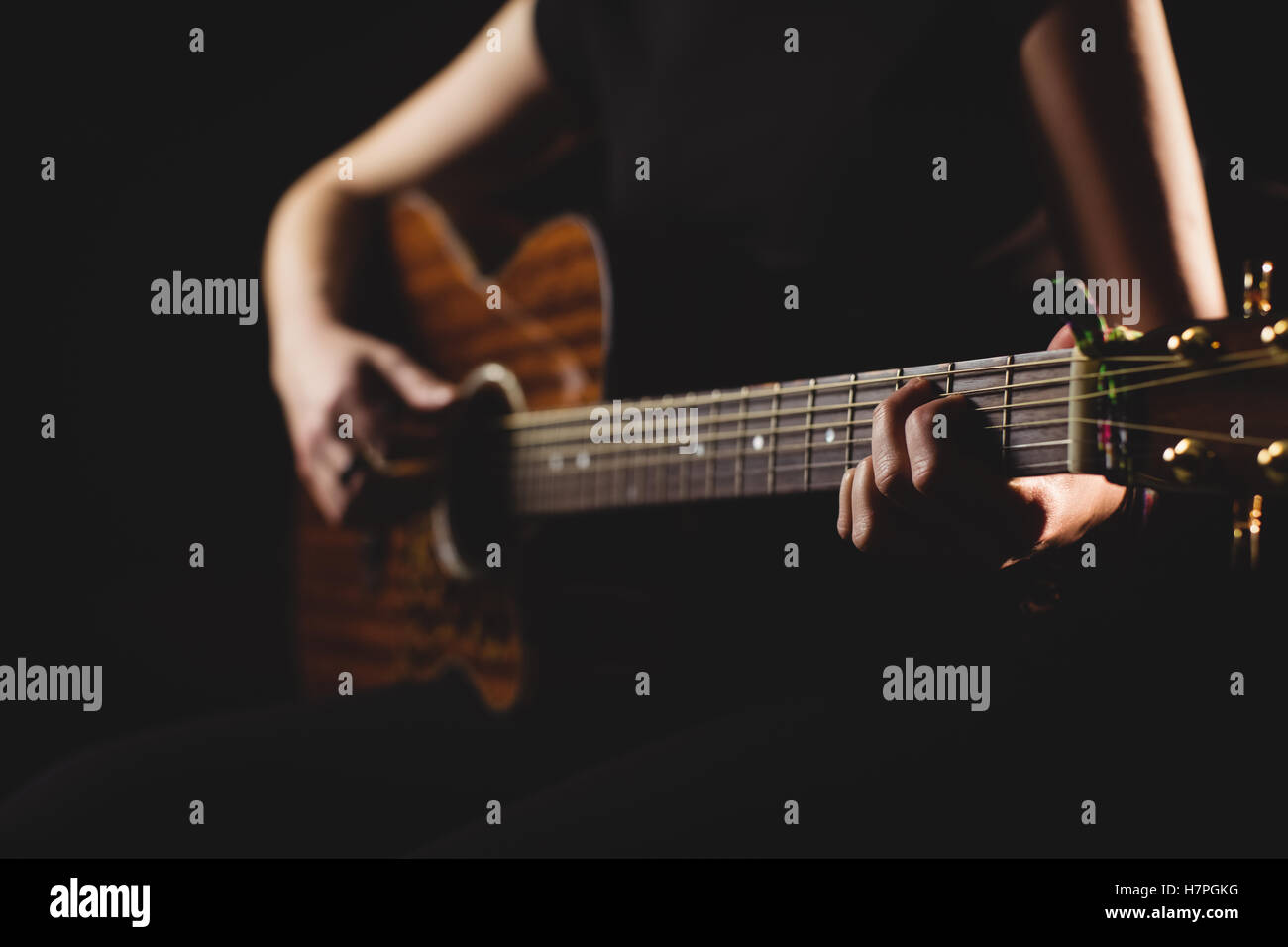 Mid-section female student playing guitar Stock Photo - Alamy Mid-section female student playing guitar Stock Photo - Alamy
