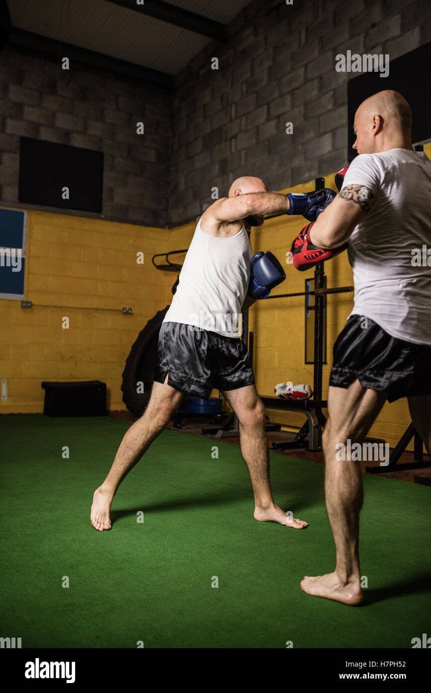 Boxers practicing boxing in the fitness studio Stock Photo - Alamy