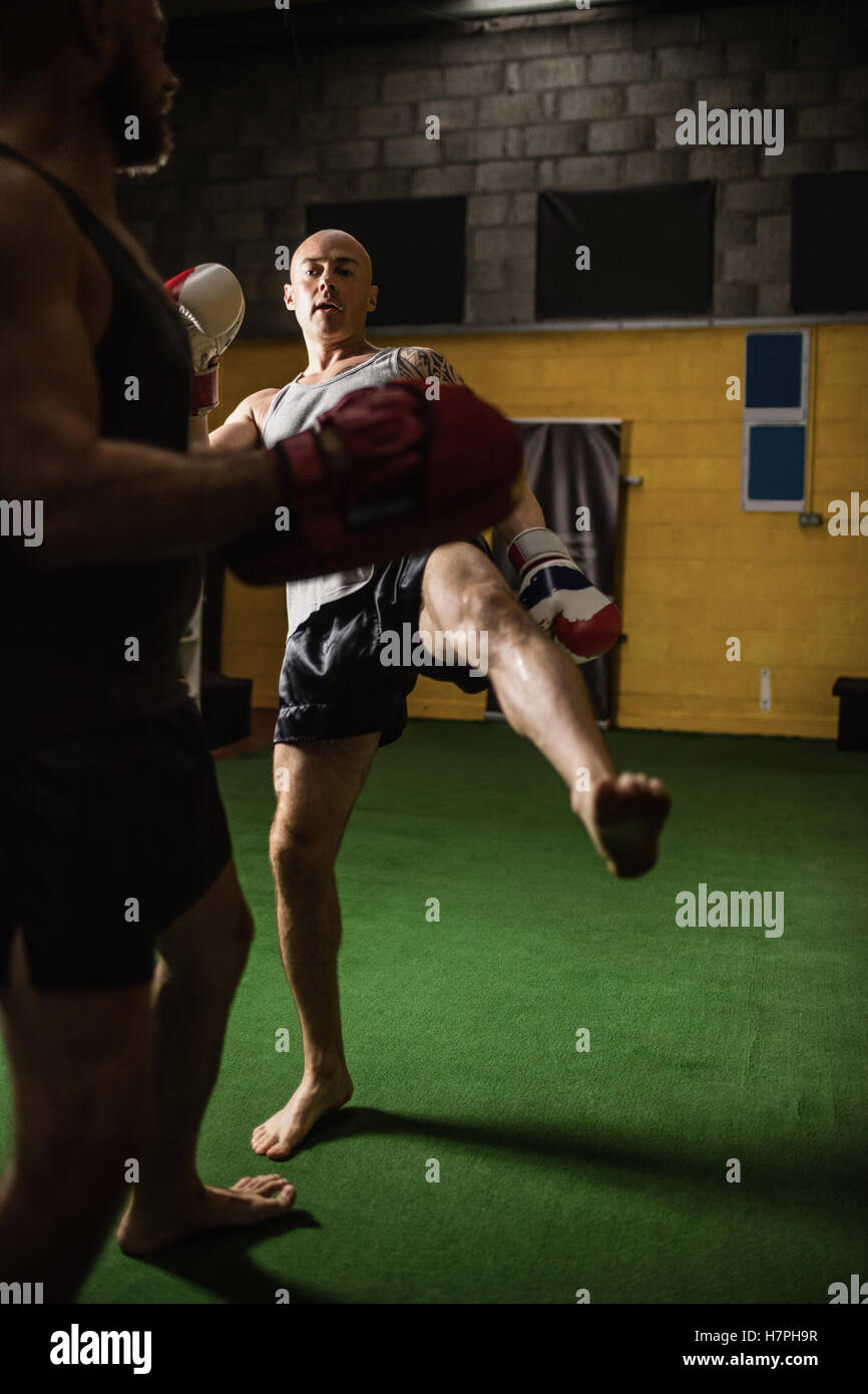 Boxers practicing boxing in the fitness studio Stock Photo - Alamy