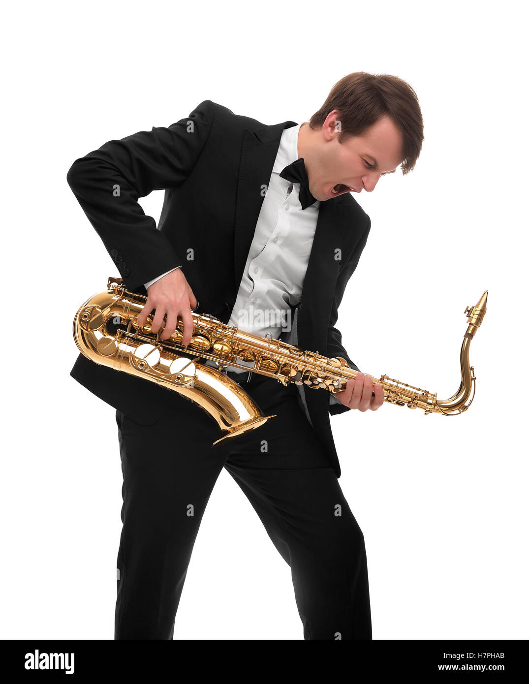 Saxophonist playing saxophone hard rock with a funny face Stock Photo ...