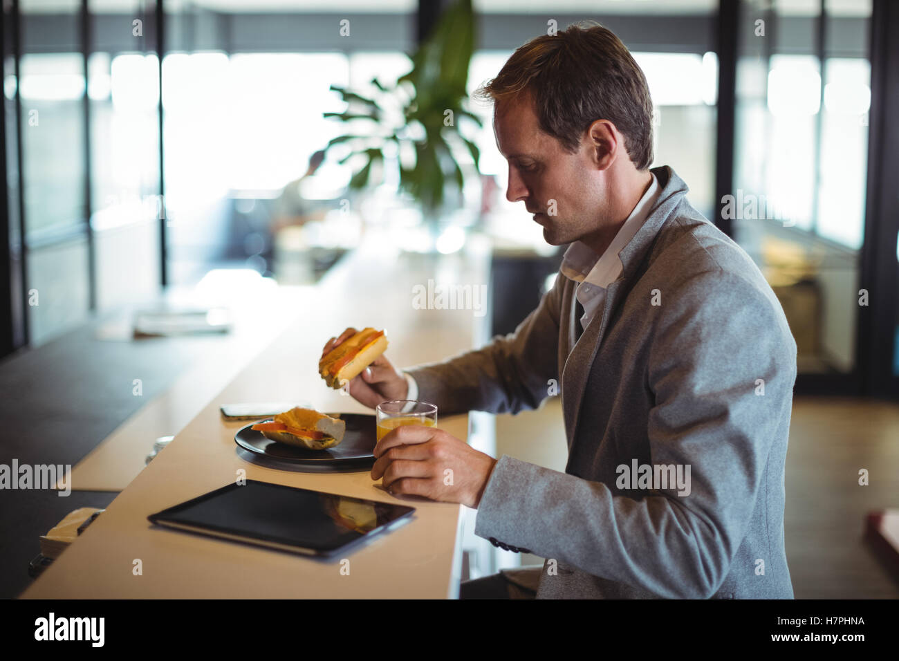 Businessman breakfast cafe hi-res stock photography and images - Alamy
