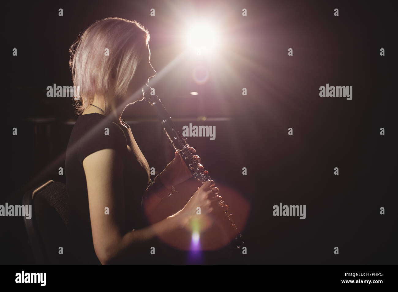 Woman playing a clarinet Stock Photo - Alamy