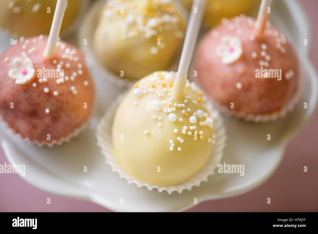 Close up of pink and white cake pops on cakestand Stock Photo - Alamy