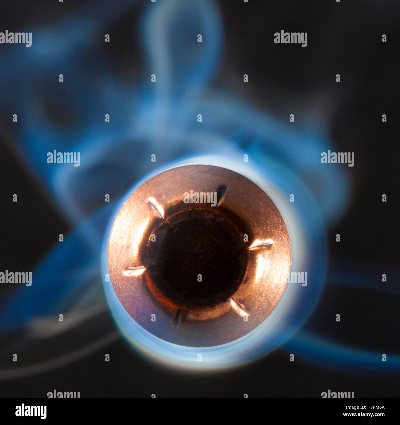 Bullet that appears to be coming at the camera with smoke behind Stock ...