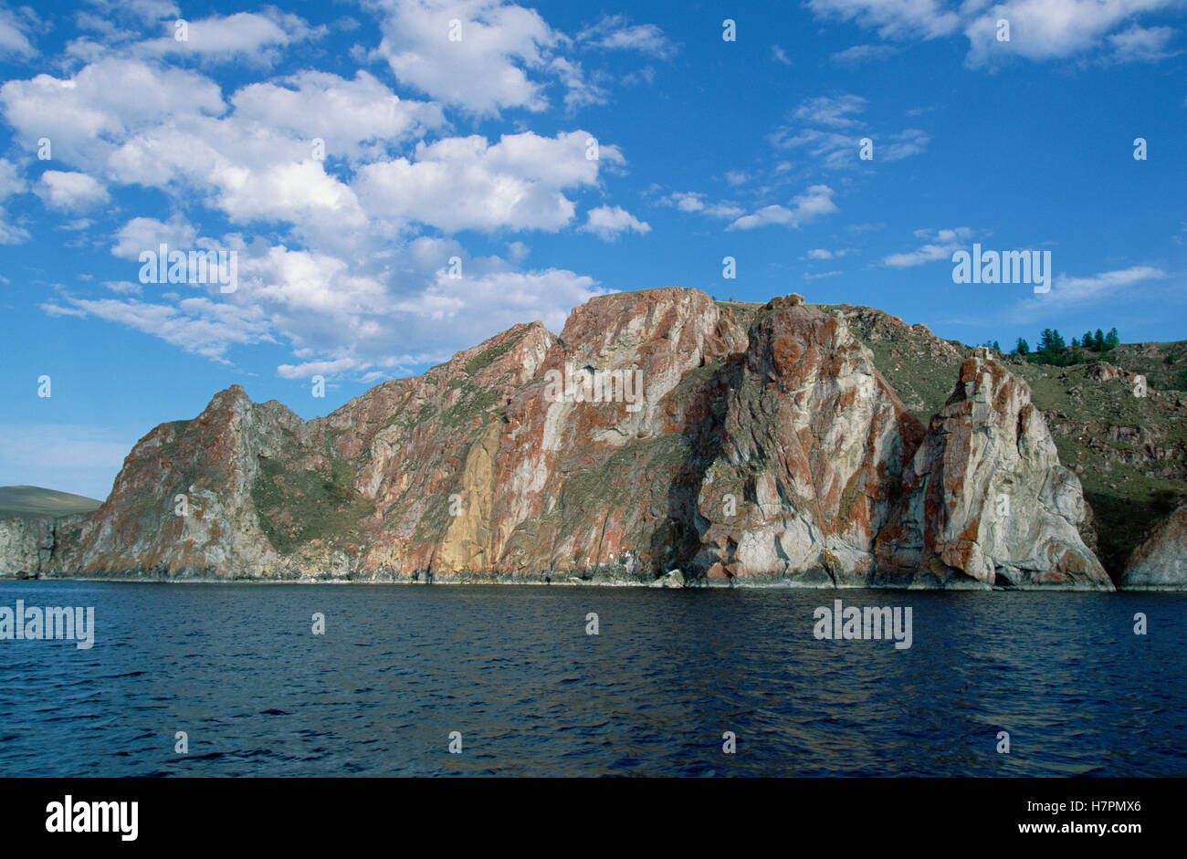 Red rocks cliffs along shoreline, Lake Baikal, Russia Stock Photo - Alamy