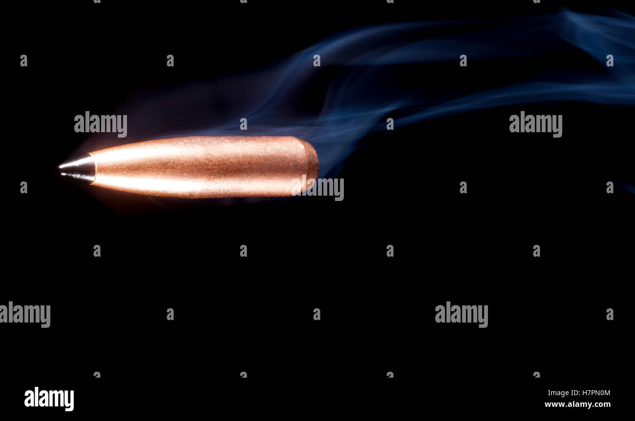 Black polymer tip on a copper plated bullet with smoke Stock Photo - Alamy