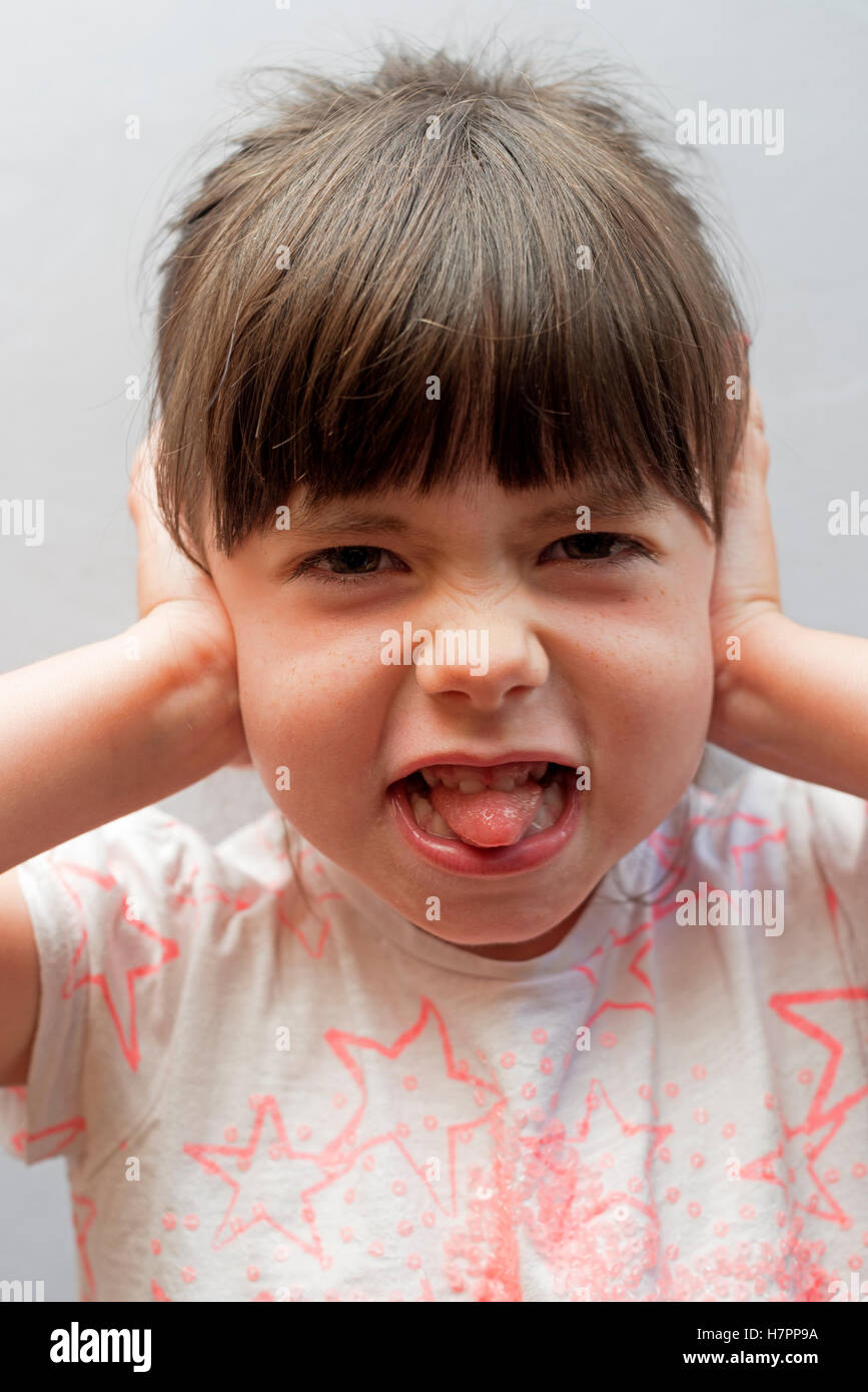 Child hands over ears hi-res stock photography and images - Alamy