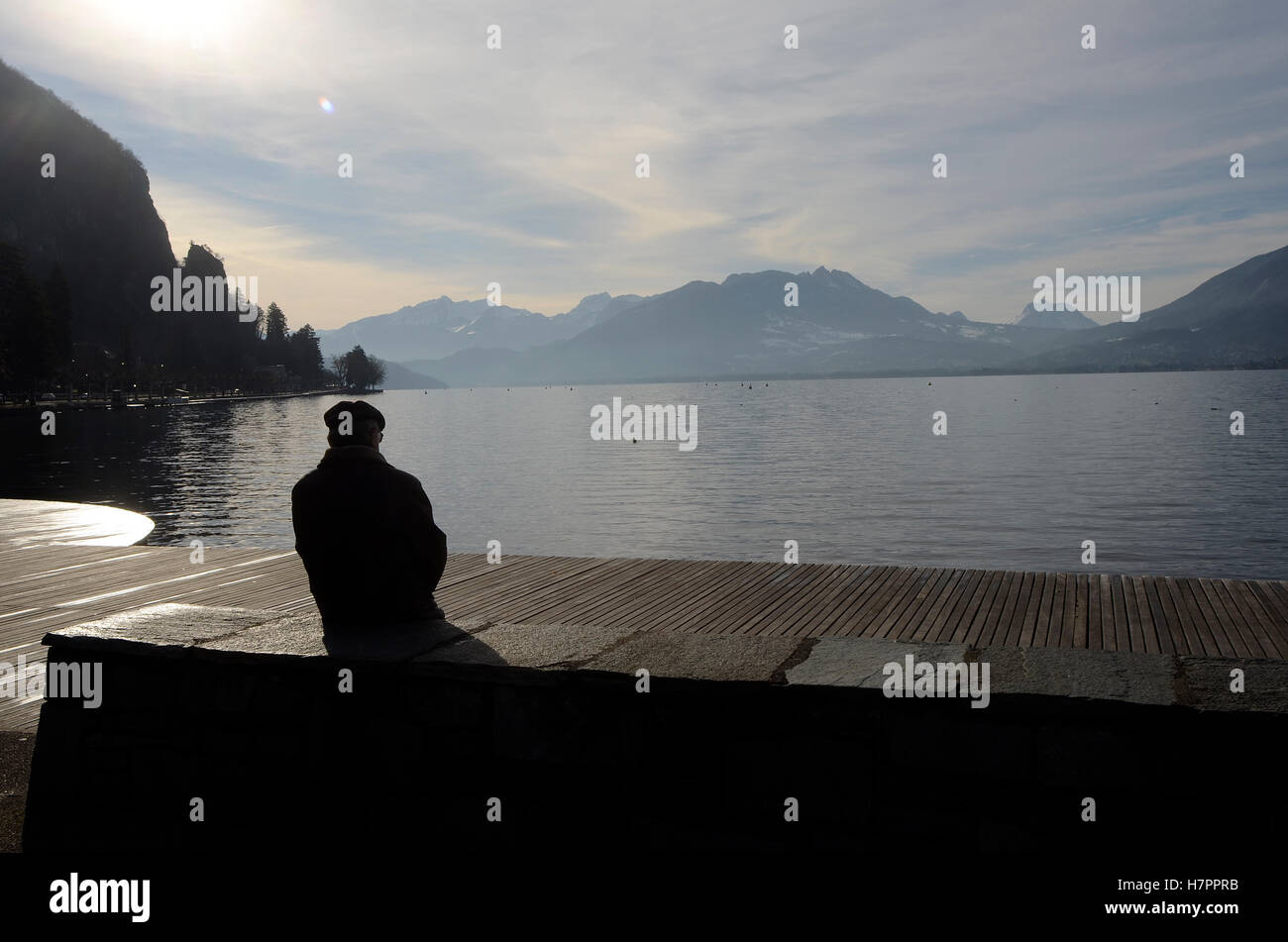 Old french man sitting in front of Annecy lake in France Stock Photo ...