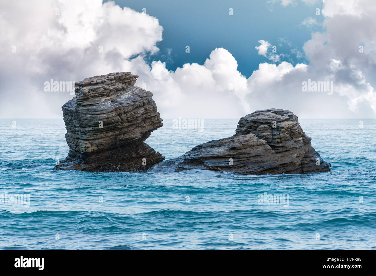Two rocks isolated in the sea Stock Photo - Alamy