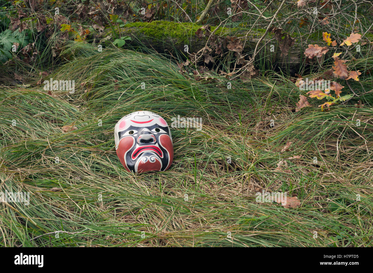 an abandoned mask on the field Stock Photo - Alamy