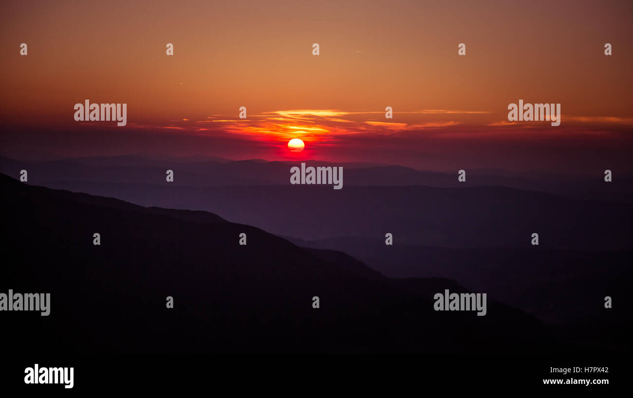 A beautiful view of the sunset in mountains Stock Photo - Alamy