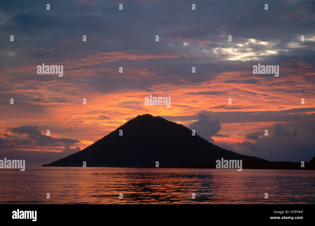 Sunset clouds around the silhouette of Manado Tua Volcano, Manado ...