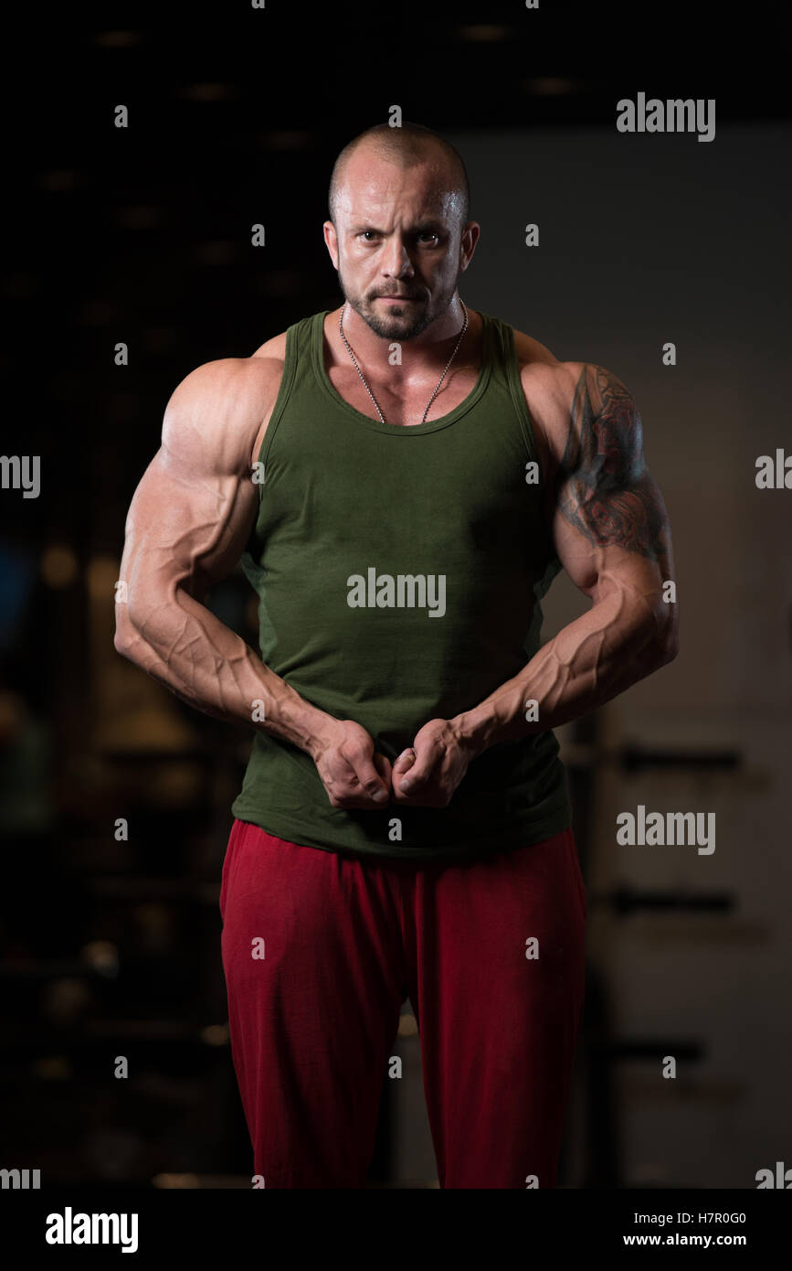 Bodybuilder Posing In Different Poses Demonstrating Their Muscles ...