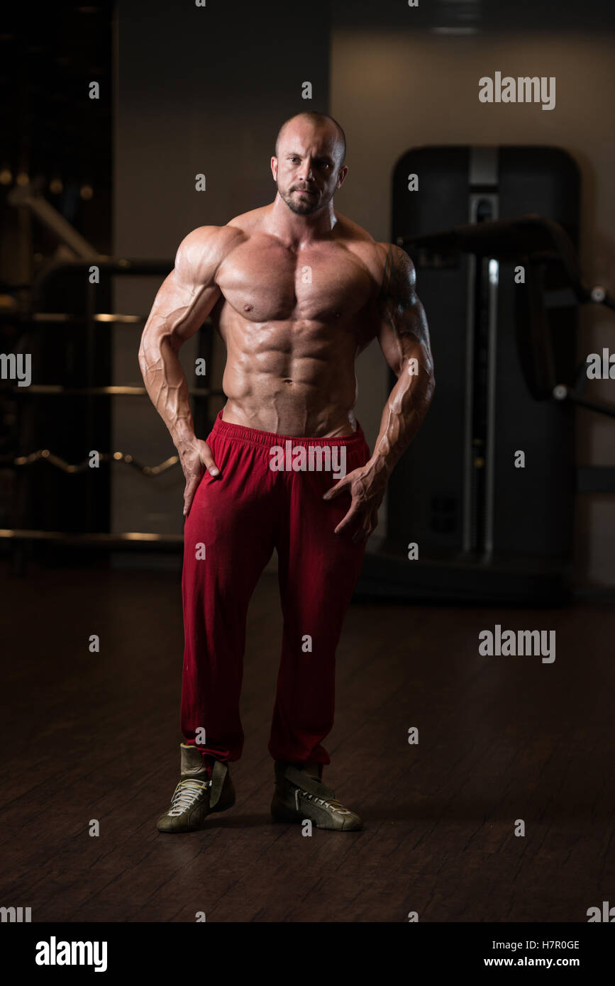 Bodybuilder Posing In Different Poses Demonstrating Their Muscles ...