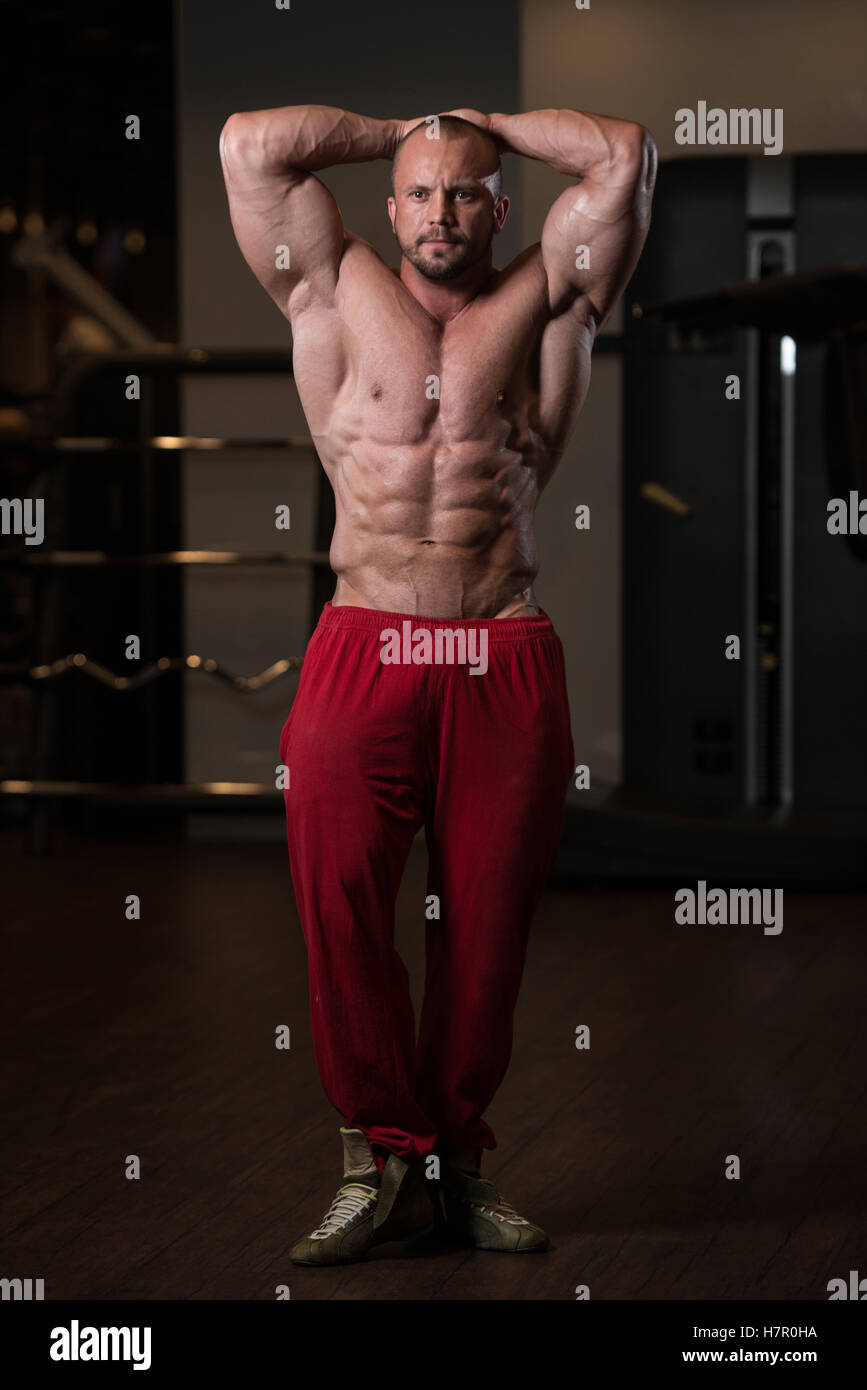 Bodybuilder Posing In Different Poses Demonstrating Their Muscles ...