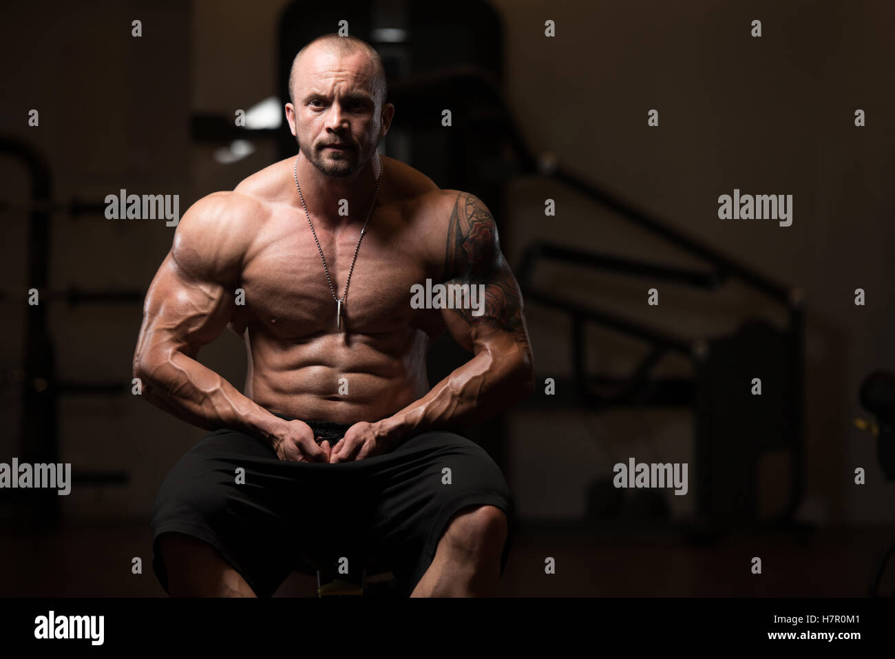 Bodybuilder Posing In Different Poses Demonstrating Their Muscles ...