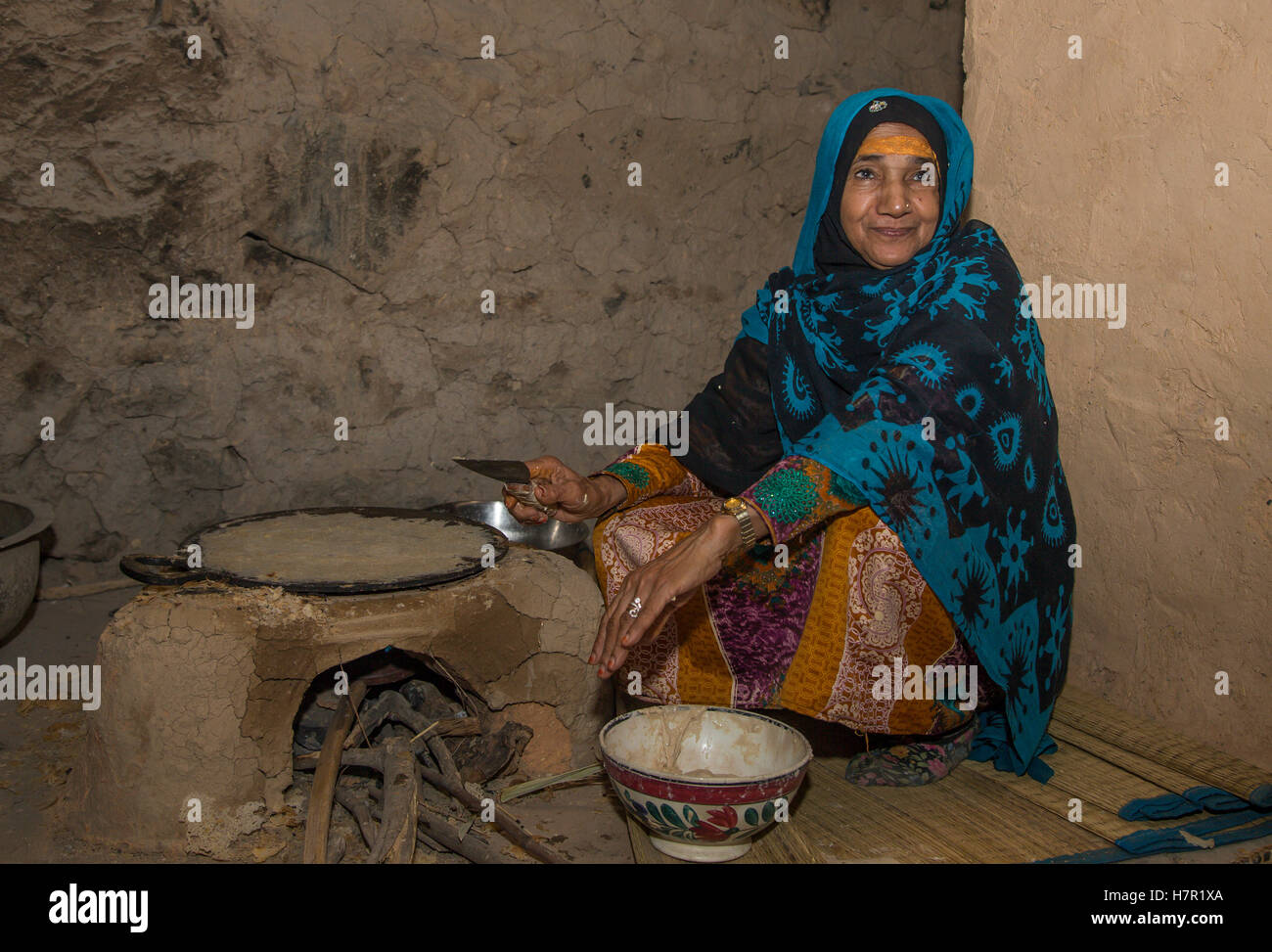 Nizwa, Oman, November 3rd, 2016: Omaniya making traditional bread Stock ...