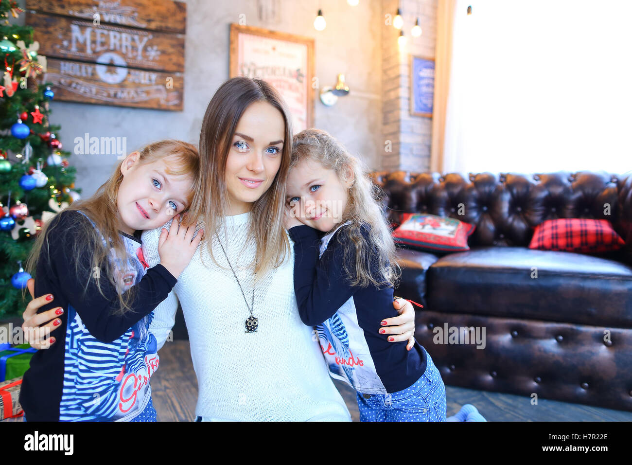 Beautiful female sisters pose for camera, smiling and embracing in ...